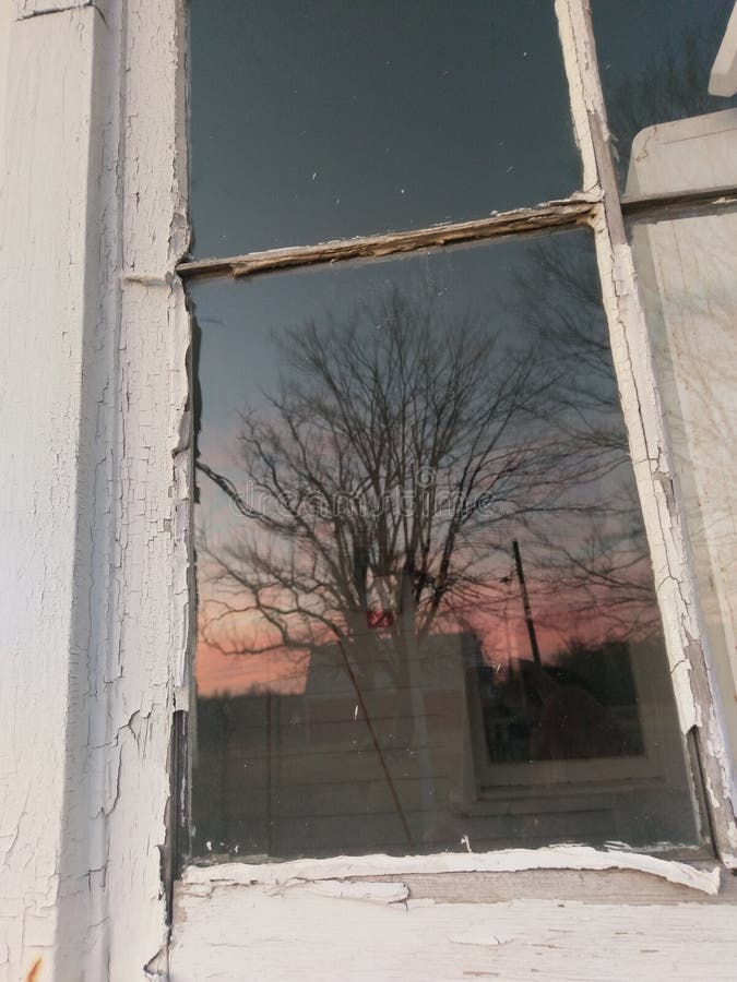 Pretty Sky and Tree Reflection in Window at Sunset Stock Photo - Image ...