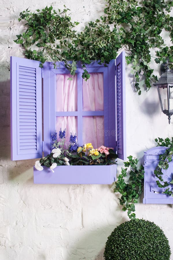 Pretty Small Purple Window and Box with Flowers in an Old House Stock ...