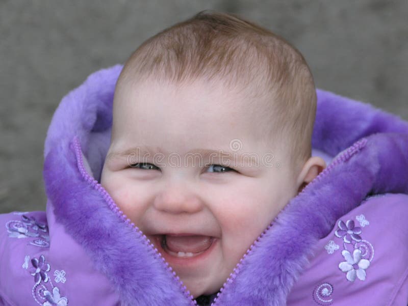 Pretty Smiling Baby In Purple Picture. Image: 2581952