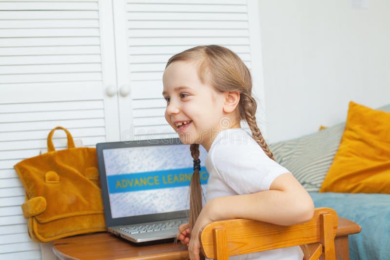 Pretty Smiling Child Girl Using Laptop at Home Stock Photo - Image of ...