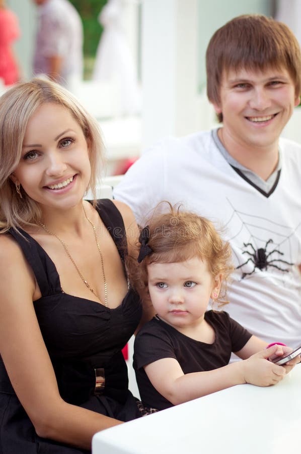 Pretty Smiling Family and Daughter Stock Photo - Image of outside ...