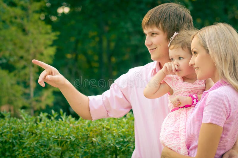 Pretty Smiling Family and Daughter Stock Image - Image of father, field ...