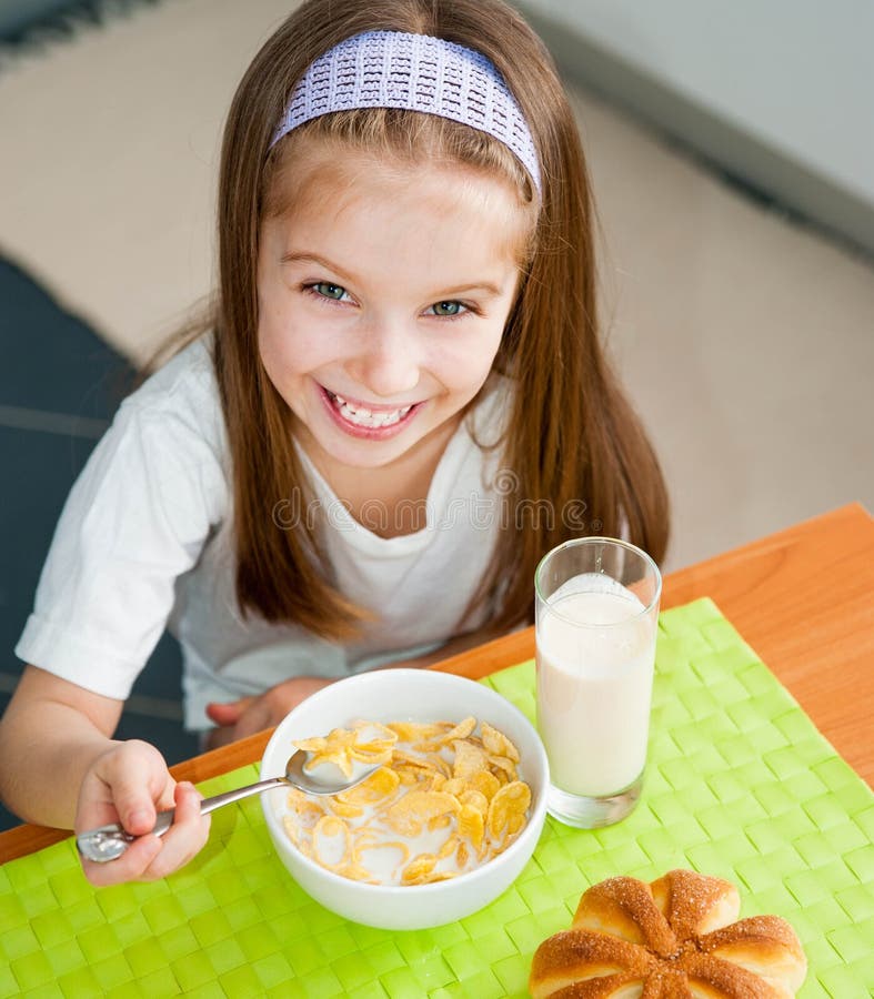 Little Girl Eating Her Breakfast Stock Image - Image of interior, home ...