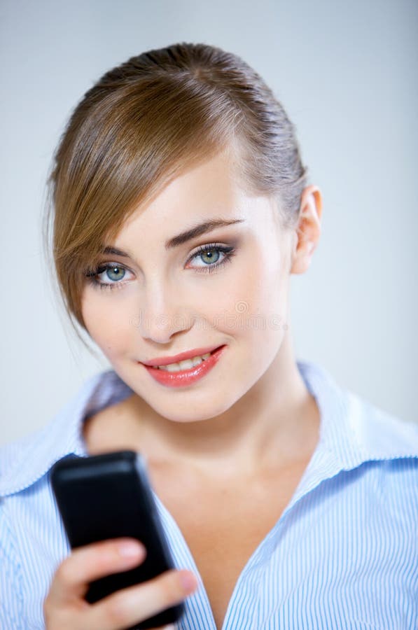 Pretty Smiling Woman Using Black Mobile Phone Stock Photo - Image of ...