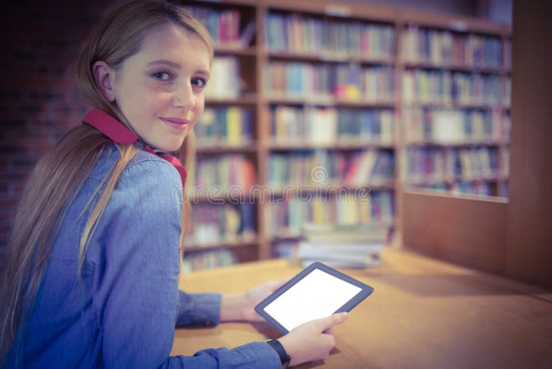Pretty Student with Headphones Using Tablet in Library Stock Image ...