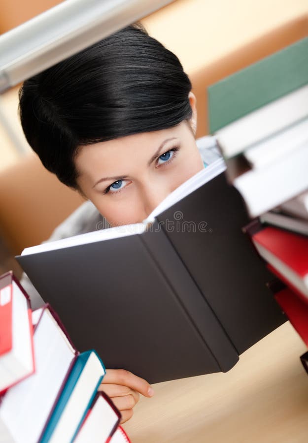 Blonde Woman Peering Over Book Stock Photo - Image of head, peer: 32840214