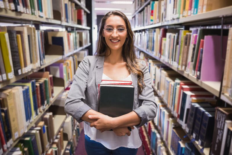 Pretty Student Picking Out a Book in Library Stock Photo - Image of ...