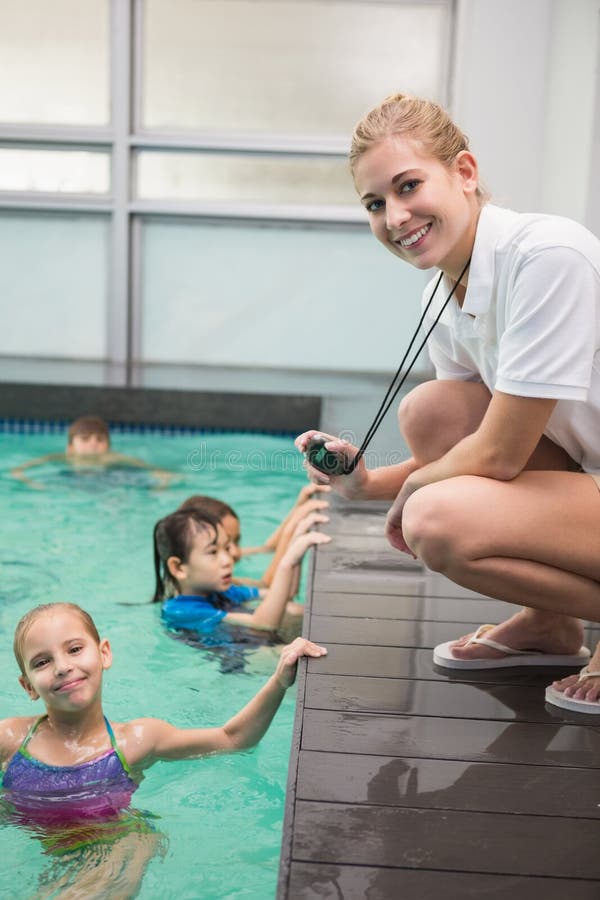 Pretty Swimming Coach Smiling at Camera Stock Photo - Image of indoors ...
