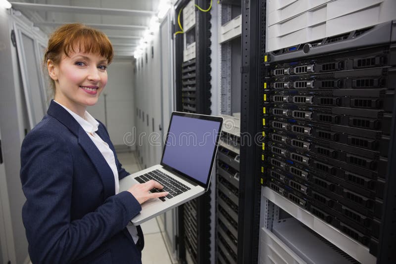Pretty Technician Using Laptop while Working on Servers Stock Photo ...