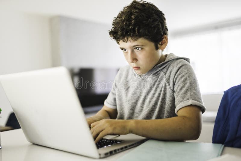 Pretty Teen Boy Enjoys Learning and Doing Some Homework Stock Photo ...