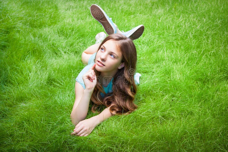 Pretty Teen Girl Lying On The Grass Laughter Joy Positive Emotions