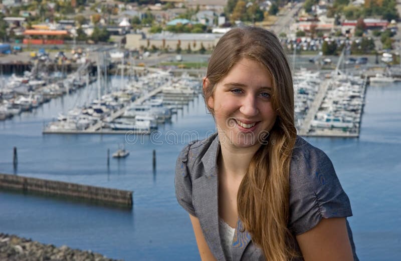 Pretty Teen with Marina in Background Stock Image - Image of portrait ...