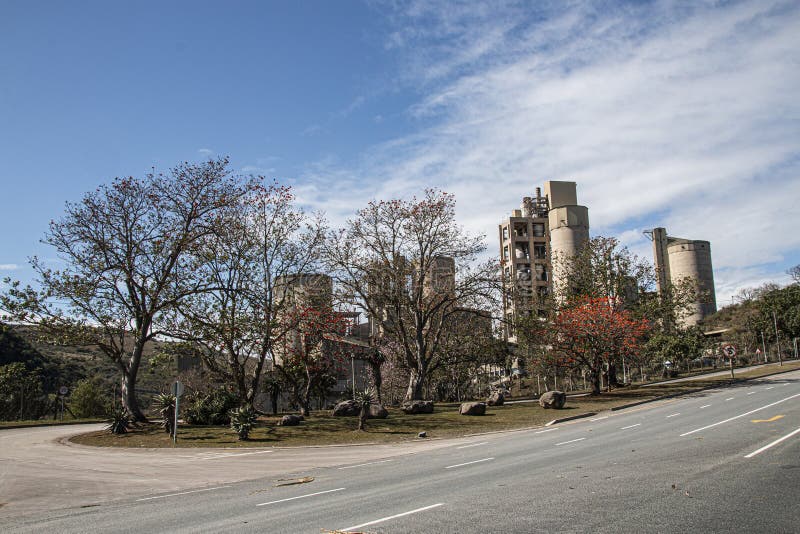 Pretty Trees Growing in Front of Cement Factory Stock Image - Image of ...