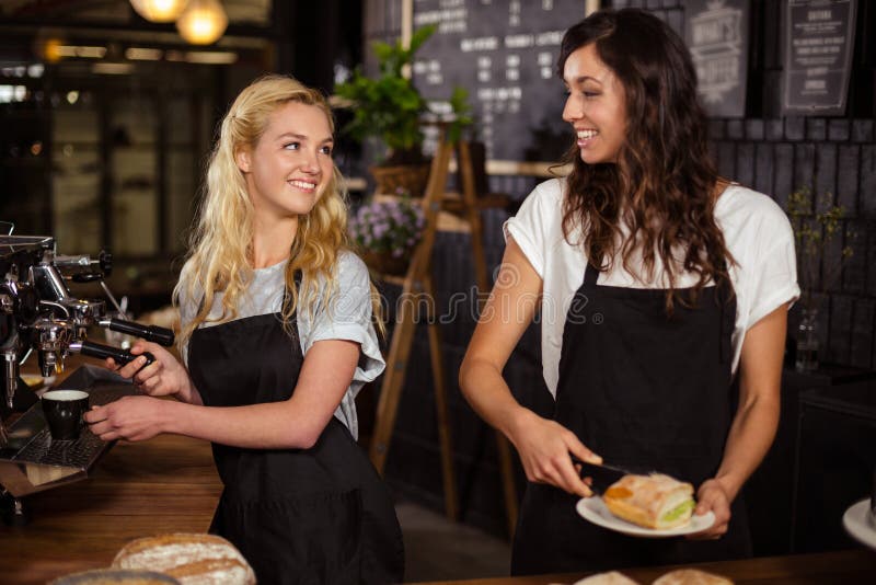 Pretty Waitresses Behind the Counter Working Stock Image - Image of ...