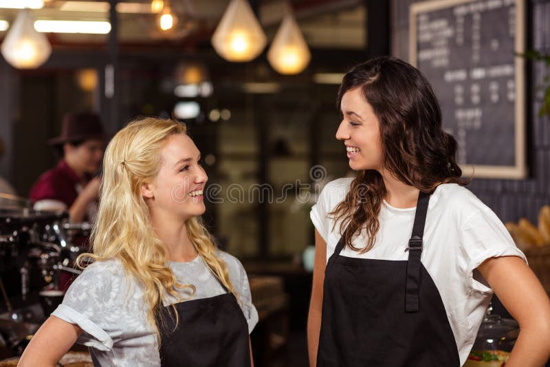 Pretty Waitresses Posing in Front of the Counter Stock Photo - Image of ...