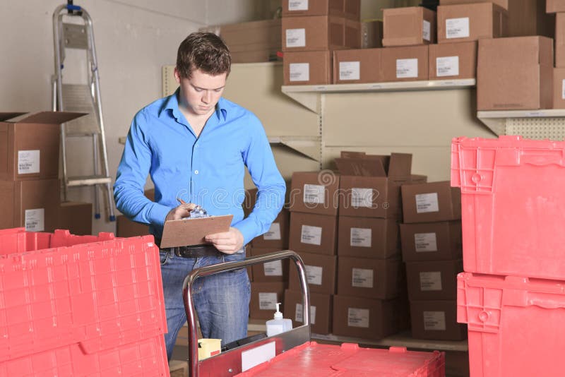 A Pretty Warehouse Manager Checking the Inventory Stock Photo - Image ...