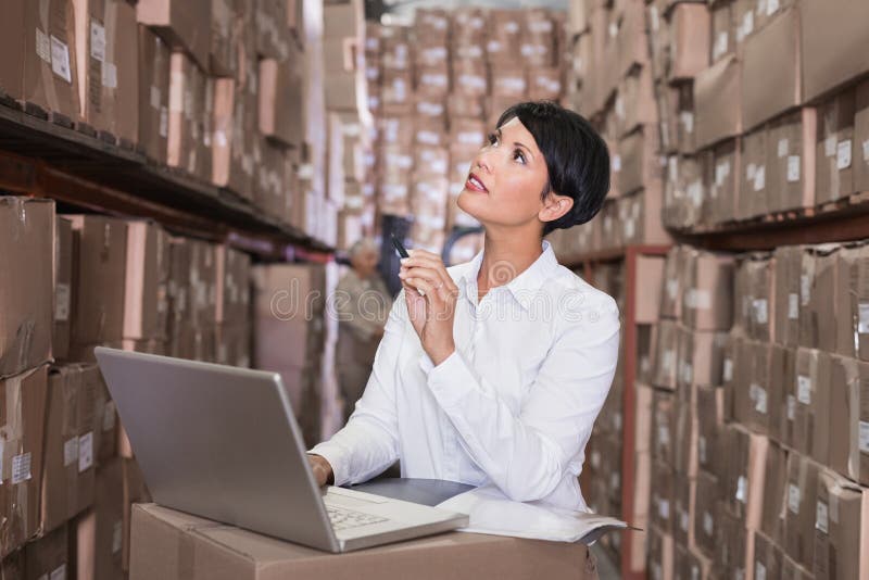 Pretty Warehouse Manager Using Laptop Stock Photo - Image of business ...