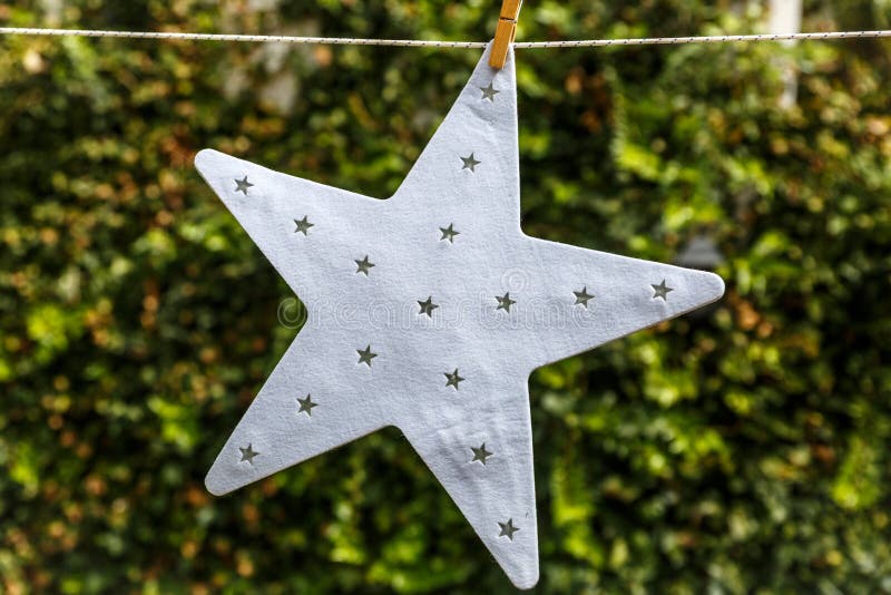 A Pretty White Star Hanging from a Rope Stock Photo - Image of merry ...