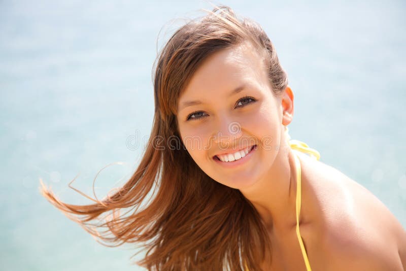 Pretty woman on the beach stock photo. Image of smile - 25421464