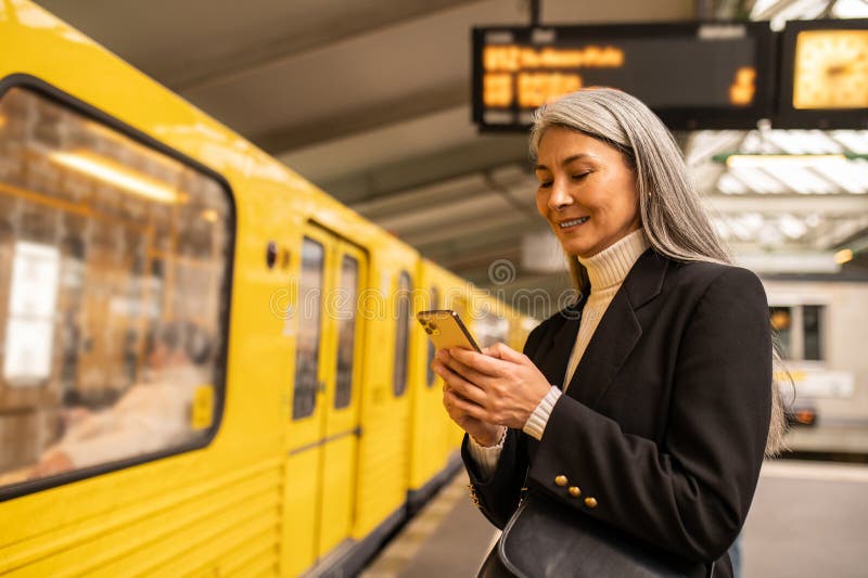 Pretty Woman in a Black Coat Waiting for the Train in Subway Stock ...