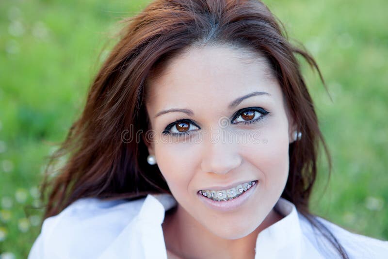 Pretty woman with brackets stock image. Image of outdoor - 52921679