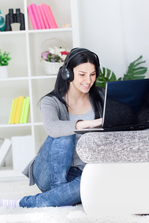 Pretty Woman with Computer and Headphones at Home Stock Image - Image ...