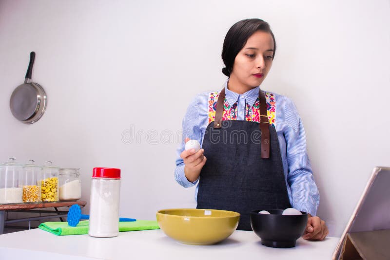 A Pretty Woman is Cooks Meal at Home Stock Photo - Image of pretty ...