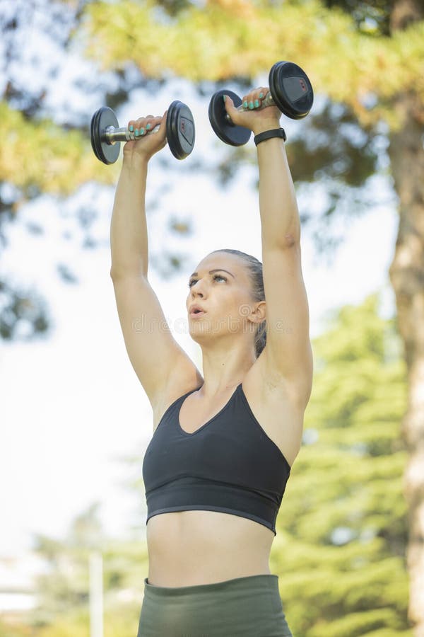Pretty Woman Doing Weights Exercises Stock Image - Image of people ...