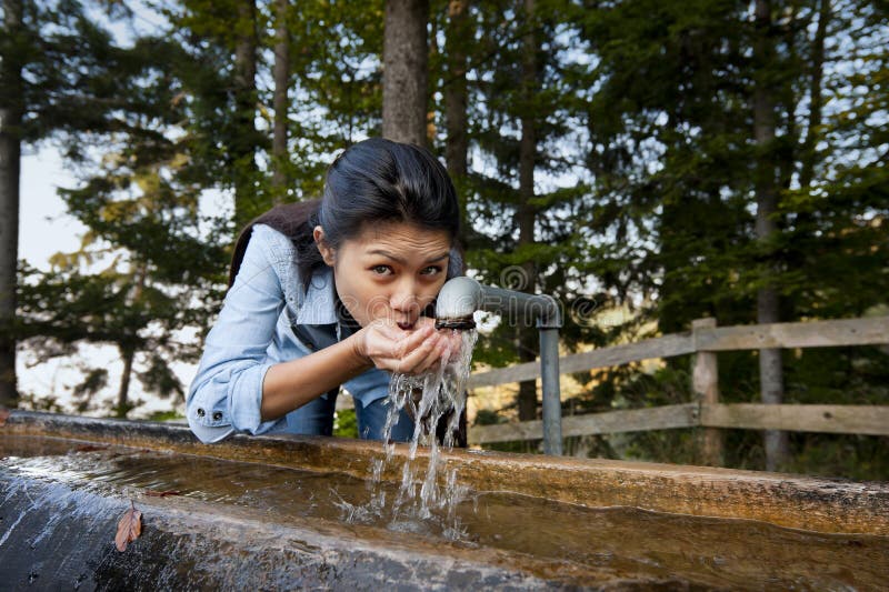 Young Girl Drinking Clean Lake Water Stock Image - Image of body ...