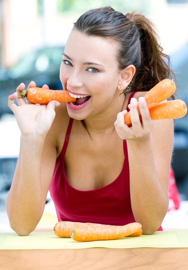 Pretty Woman Eating Carrots at Home Stock Image - Image of face, lady ...