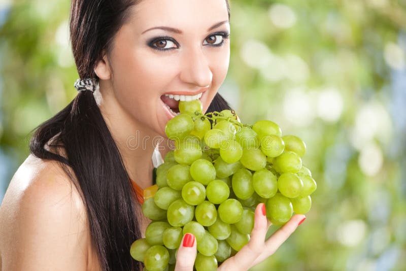Pretty woman with grape stock photo. Image of happy, healthy - 29691144