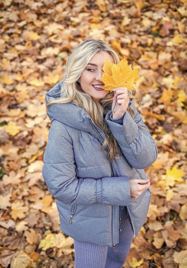 Pretty Woman With Long Curly Blonde Hair Wear Autumn Puffer Coat In