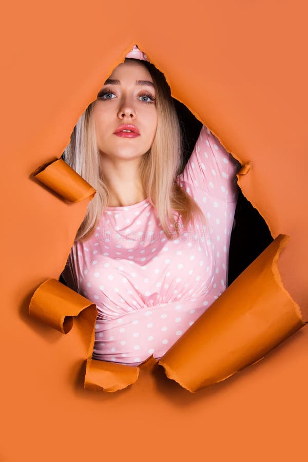 Pretty Woman Looking through a Hole in a Paper Stock Image - Image of ...