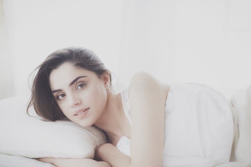 Pretty Woman Lying Down on Her Bed at Home Stock Image - Image of ...