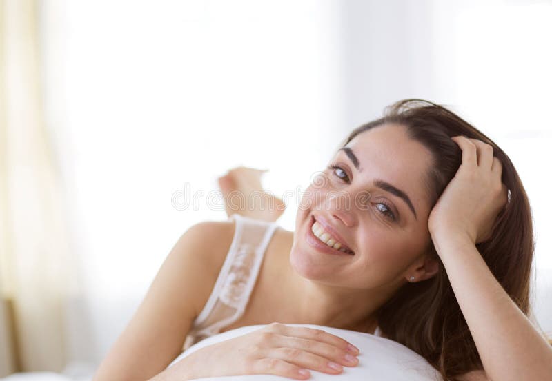 Pretty Woman Lying Down on Her Bed at Home Stock Photo - Image of ...