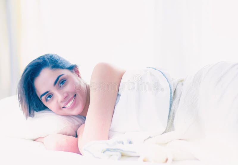 Pretty Woman Lying Down on Her Bed at Home Stock Image - Image of pose ...