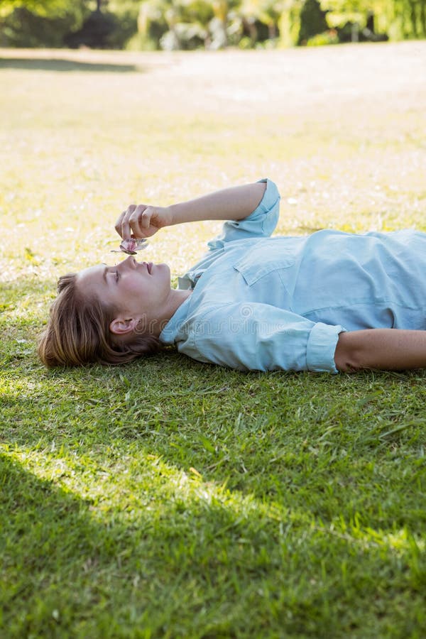Pretty Woman Lying Down in Park Stock Photo - Image of lawn, weekend ...