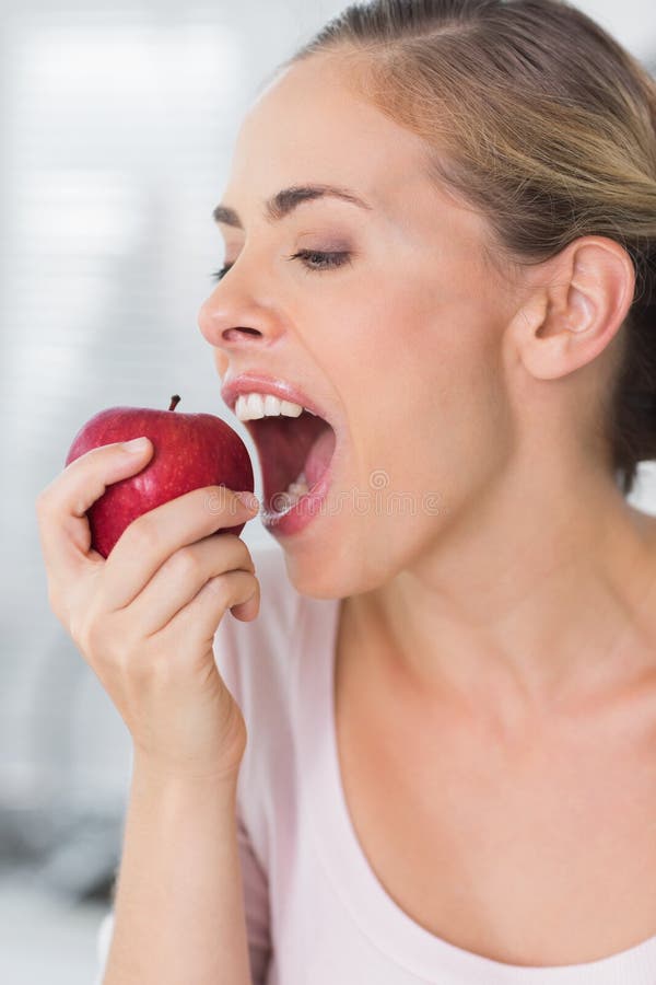 Pretty Woman Munching Apple in Close Up Stock Image - Image of ...