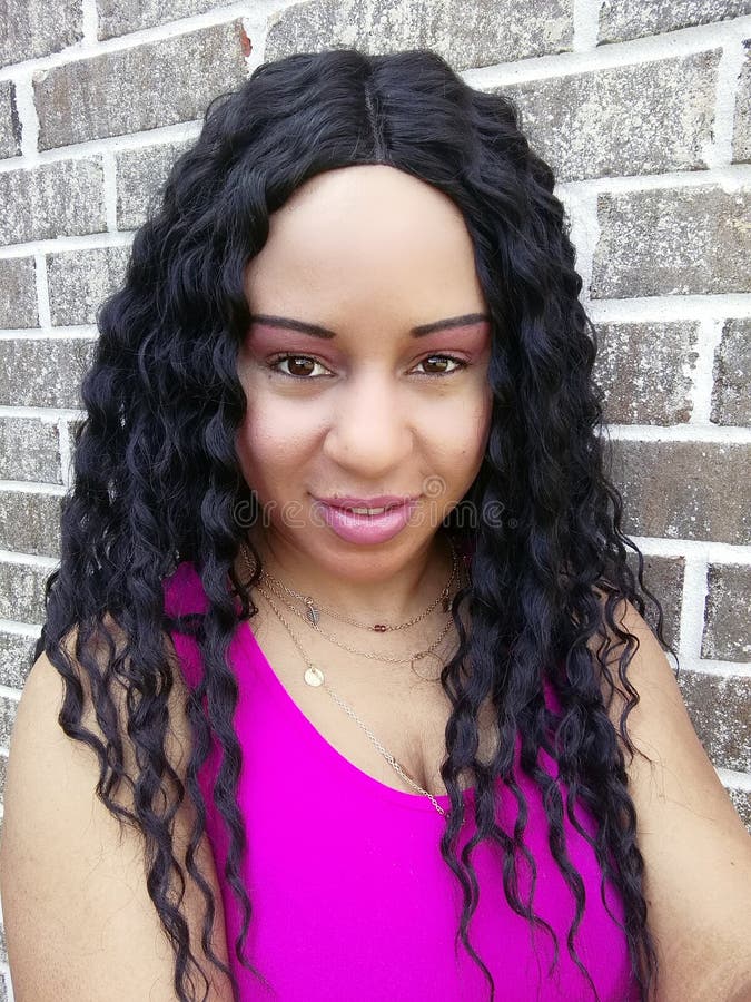 Pretty Woman Outdoors in Pink Stock Photo - Image of outdoors, brick ...