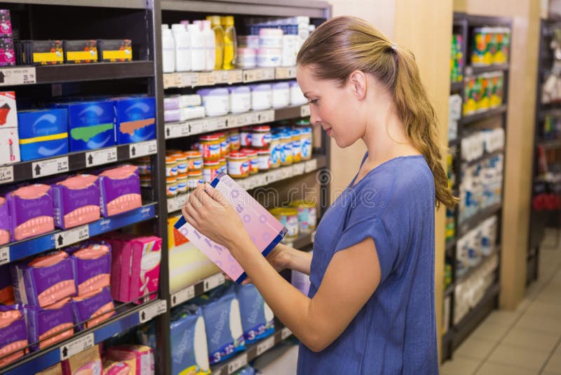 Pretty Woman Picking Box in Shelf Stock Image - Image of female, person ...