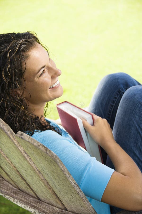 Pretty woman reading. stock image. Image of book, chair - 3419565