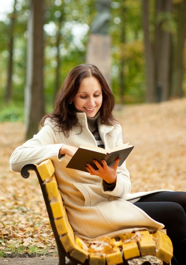 Pretty Woman Reading Book on Bench Stock Photo - Image of park ...