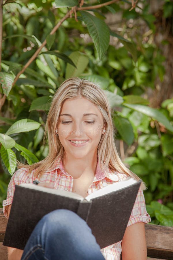 Pretty Woman Reading a Book in the Park Stock Image - Image of pretty ...