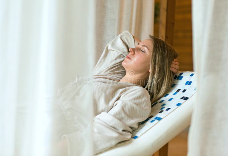 Pretty woman relaxing. stock photo. Image of beauty, interior - 75954764