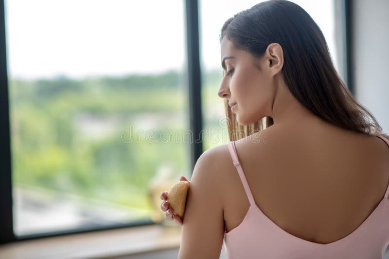 Pretty Woman Rubbing Her Arm with a Sponge Stock Photo - Image of ...