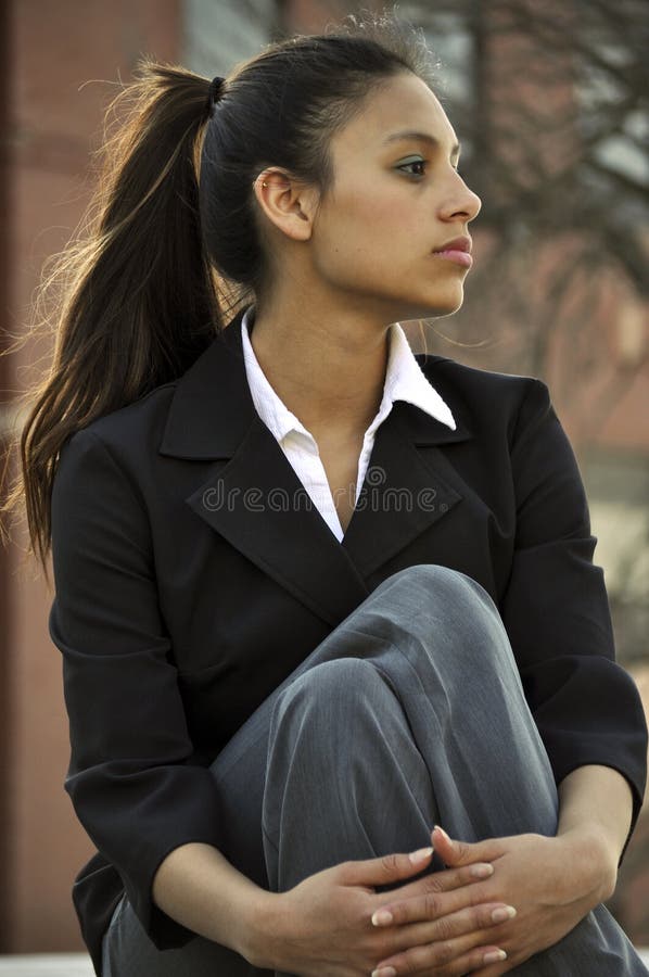Pretty woman sitting stock photo. Image of pretty, shirt - 9138224