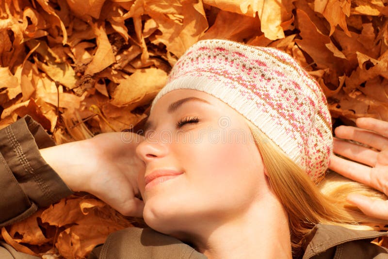 Pretty Woman Sleeping on Fall Foliage Stock Photo - Image of orange ...