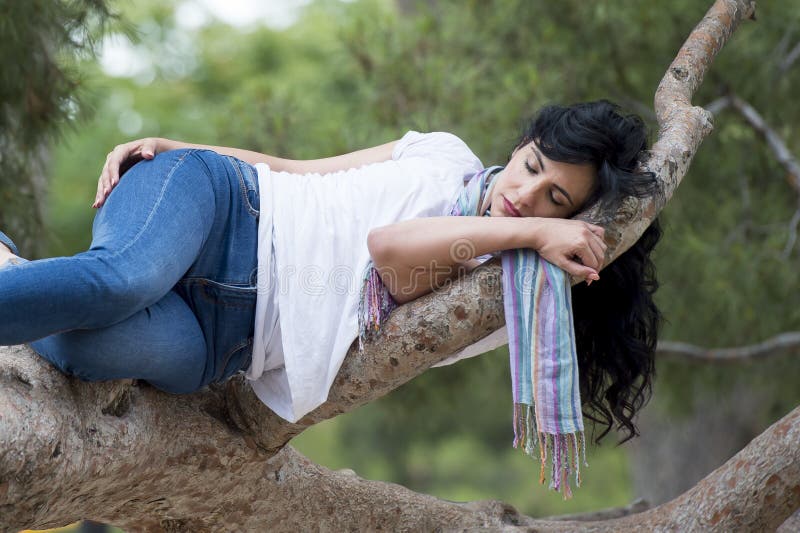 Pretty Woman Sleeping in a Tree after Being Over Worked and Having ...