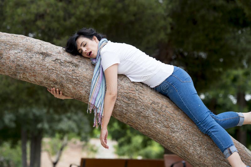 Pretty Woman Sleeping in a Tree after Being Over Worked and Having ...