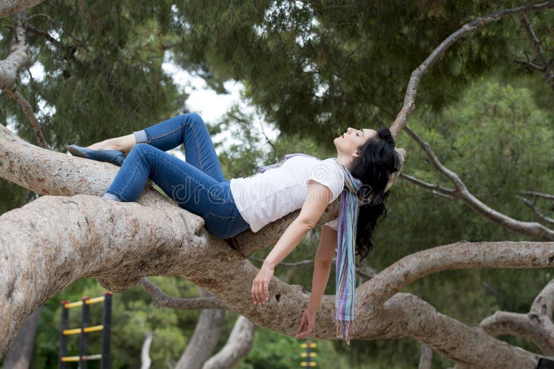 Pretty Woman Sleeping in a Tree after Being Over Worked and Having ...